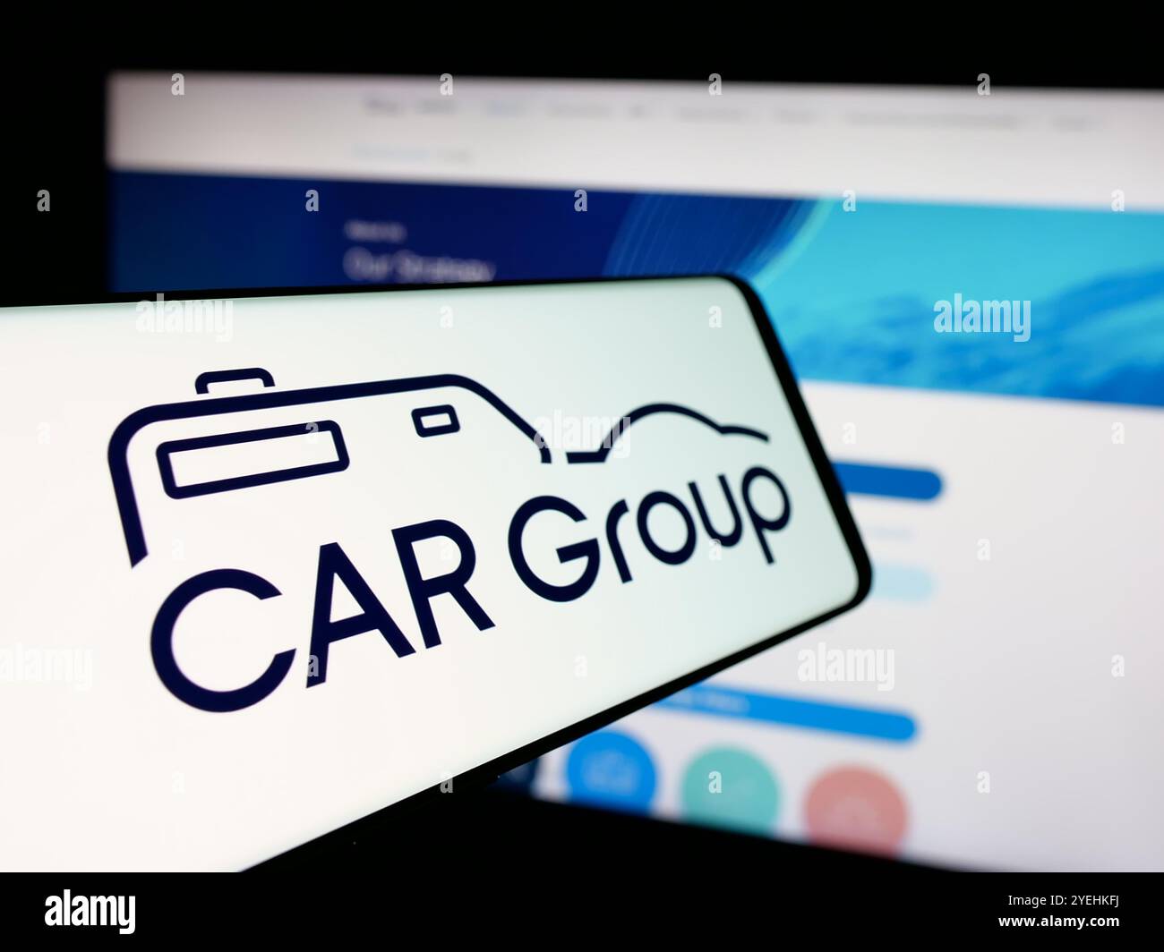 Mobile phone with logo of Australian company CAR Group Limited on ...