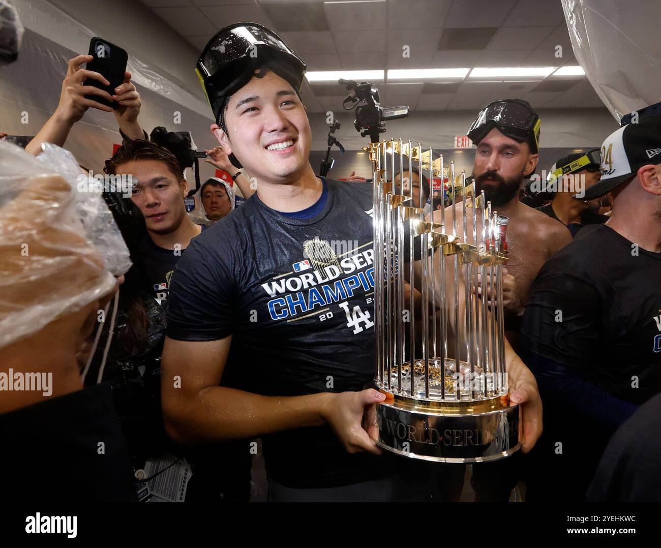 Los Angeles Dodgers' Shohei Ohtani celebrates with the trophy in New ...