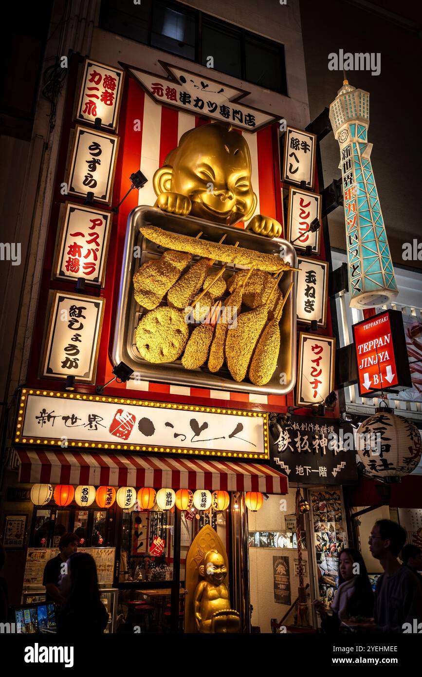 Golden doll holding kushikatsu skewers in shinsekai, osaka Stock Photo ...
