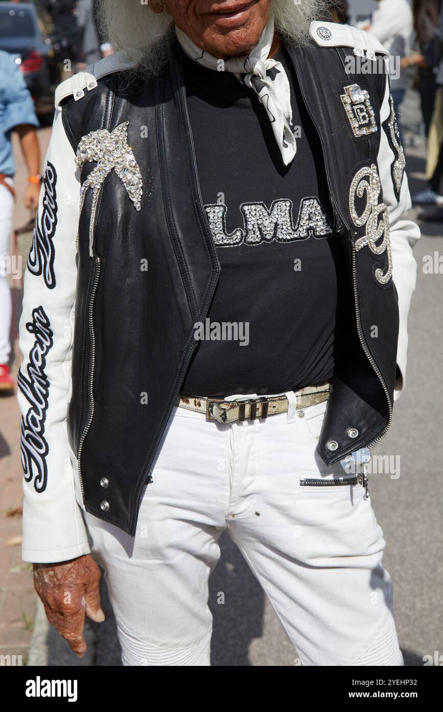 MILAN, ITALY - SEPTEMBER 17, 2024: Man with Balmain shirt and black and ...