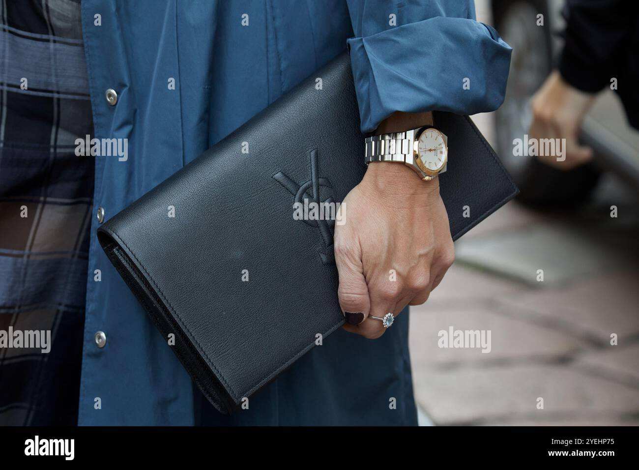 MILAN, ITALY - SEPTEMBER 17, 2024: Woman with Wempe watch and Yves ...