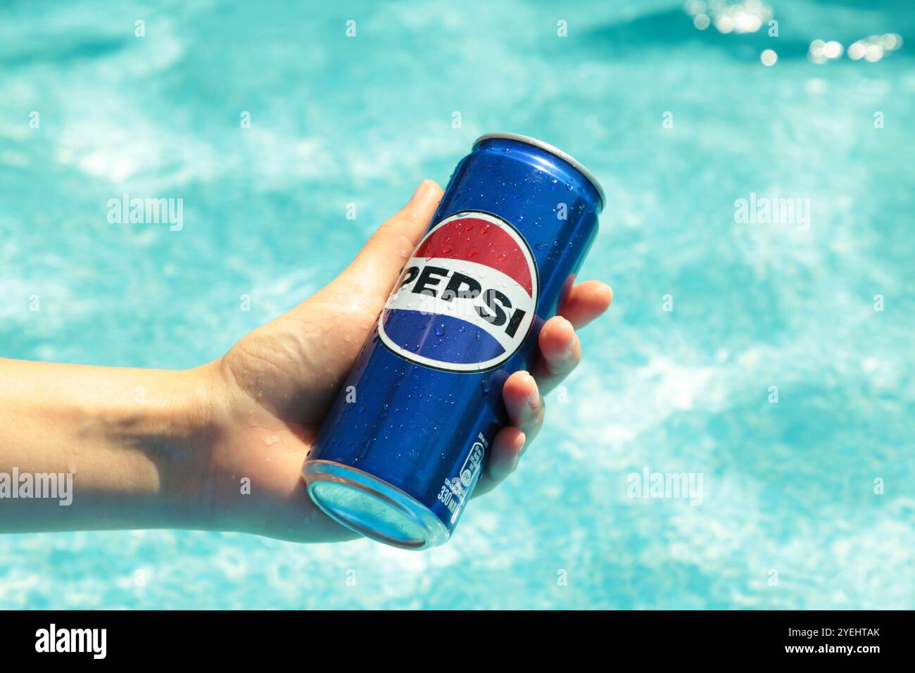 Mykolaiv, Ukraine - June 2024: Cold drink Pepsi in the hand against the ...