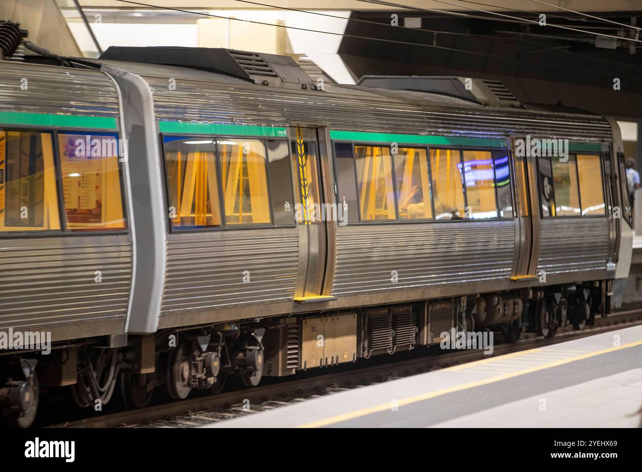 Side view of a Transperth train carriage at a station platform, with ...