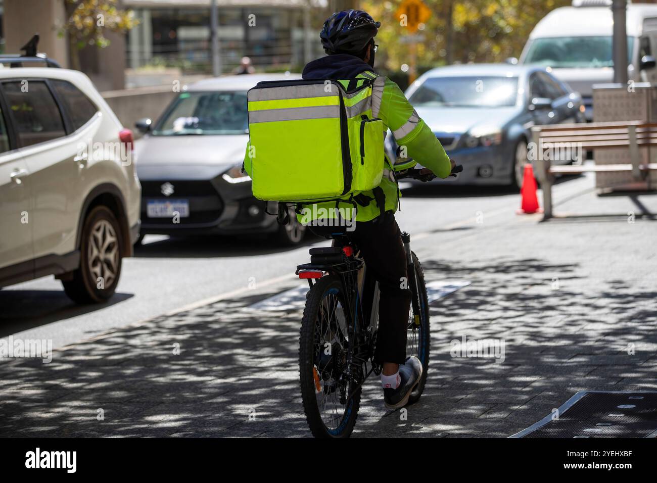 Wearing safety helmet backpack street hi-res stock photography and ...