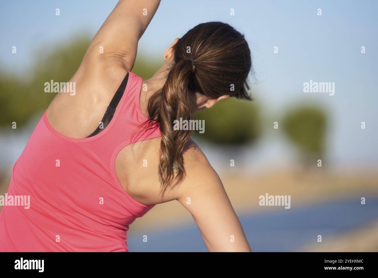 Woman doing stretching exercise for back, sport background Stock Photo ...