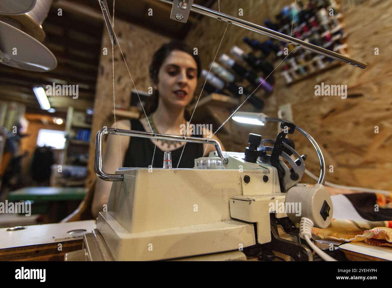 Women using sewing machine hi-res stock photography and images - Alamy