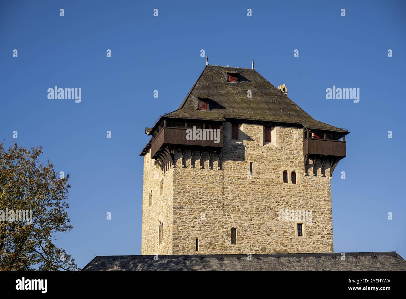 Large medieval watchtower with stone walls under a blue sky, Burg ...