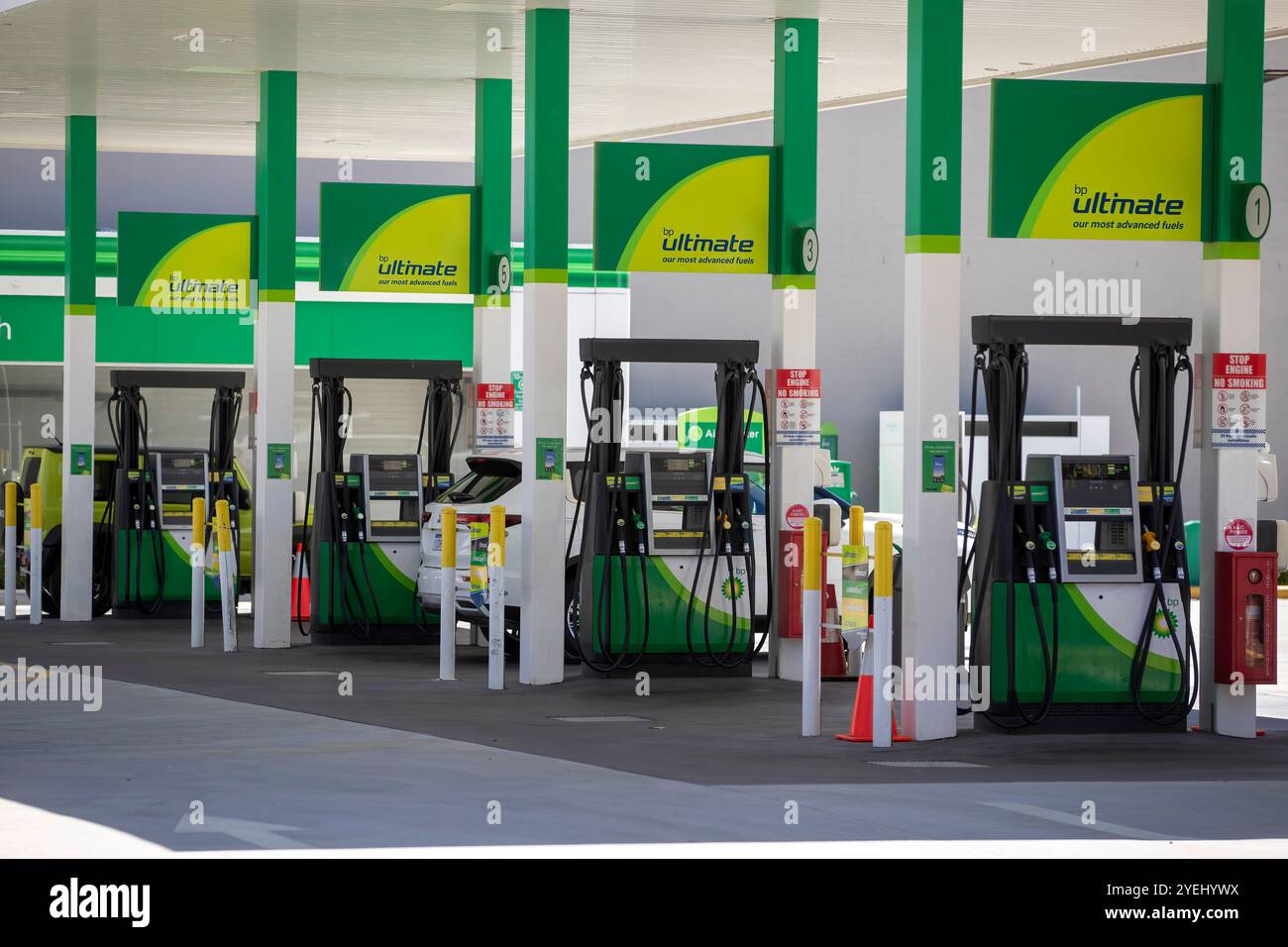A modern BP gas station with multiple fuel pumps in a bright setting Stock Photo - Alamy