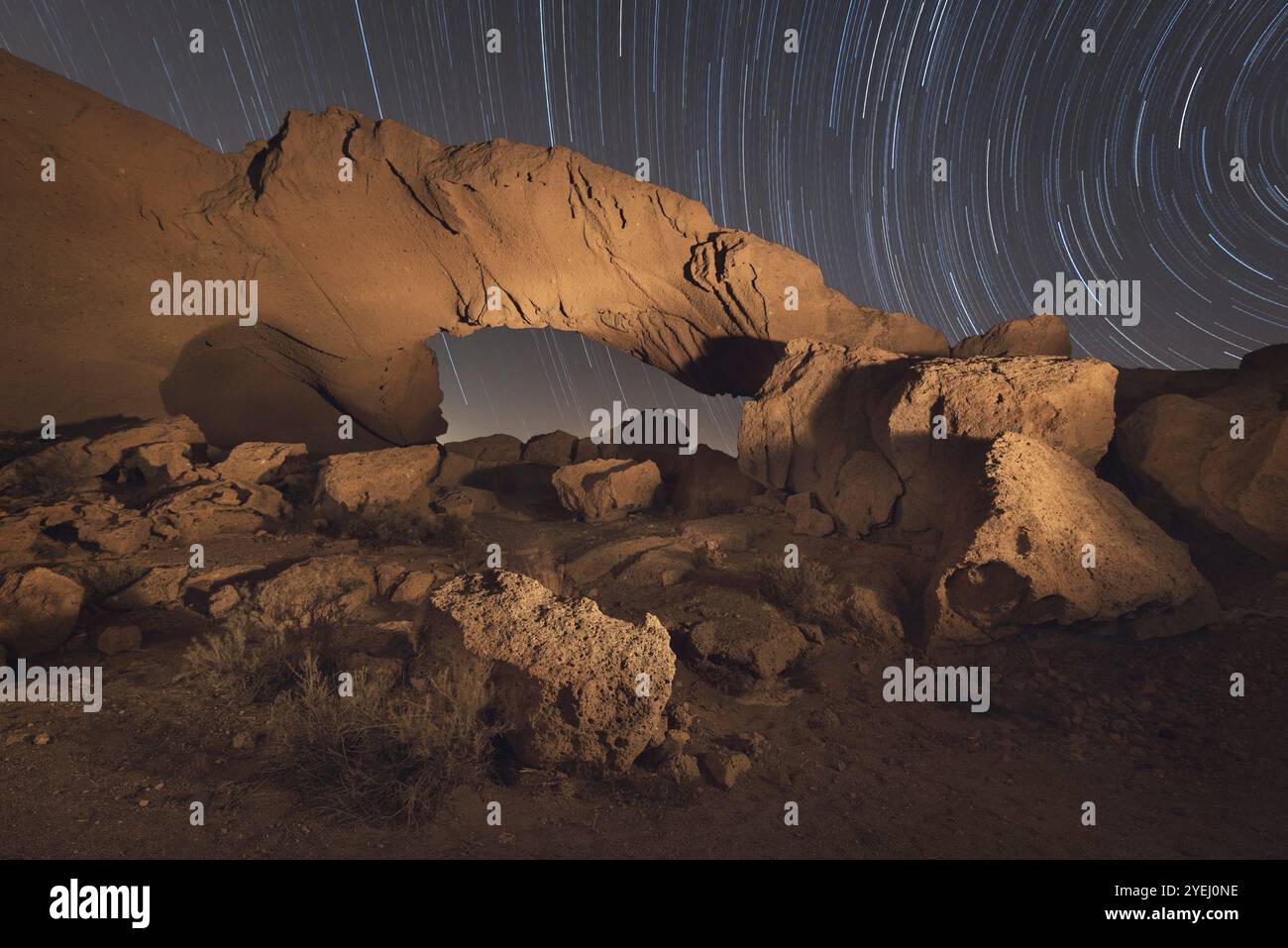 Star trails night landscape of a volcanic Rock arch in Tenerife, Canary ...
