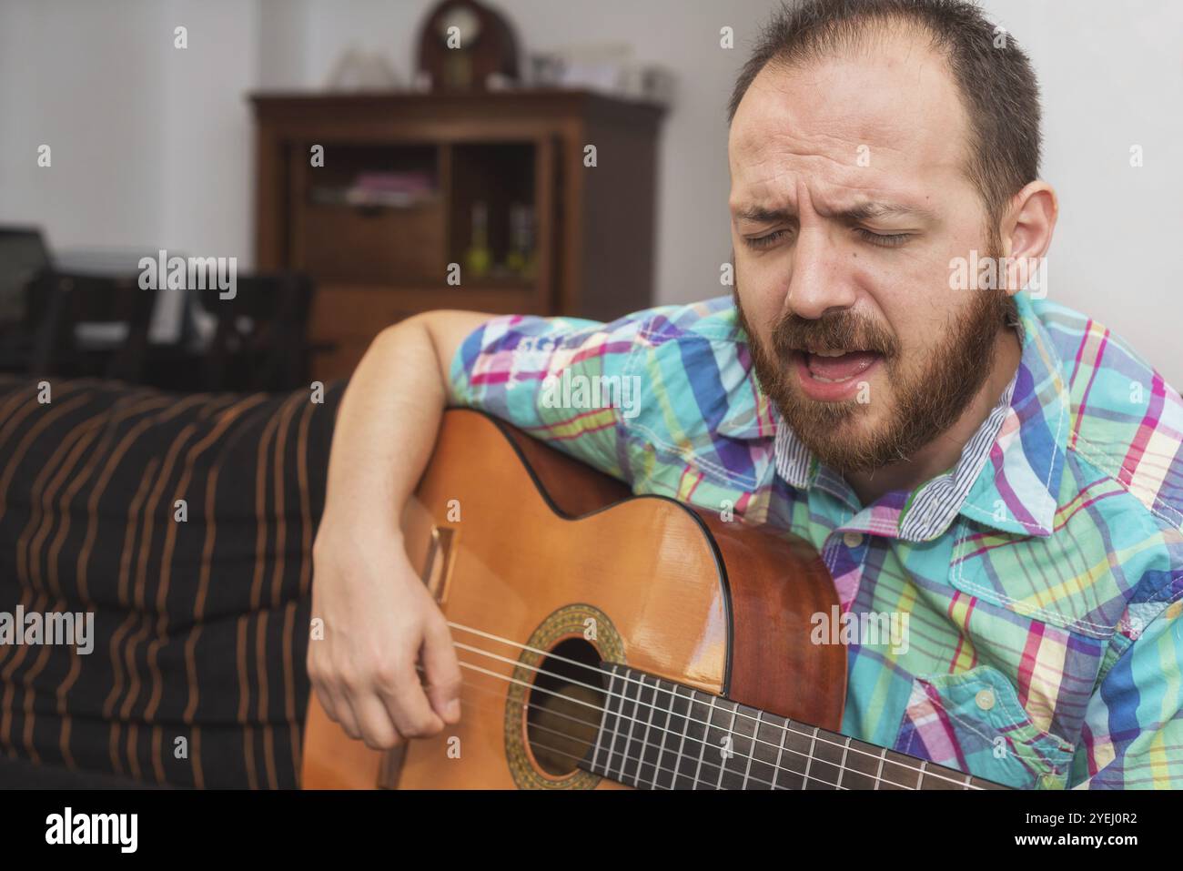 Male hand musician tunes hi-res stock photography and images - Alamy
