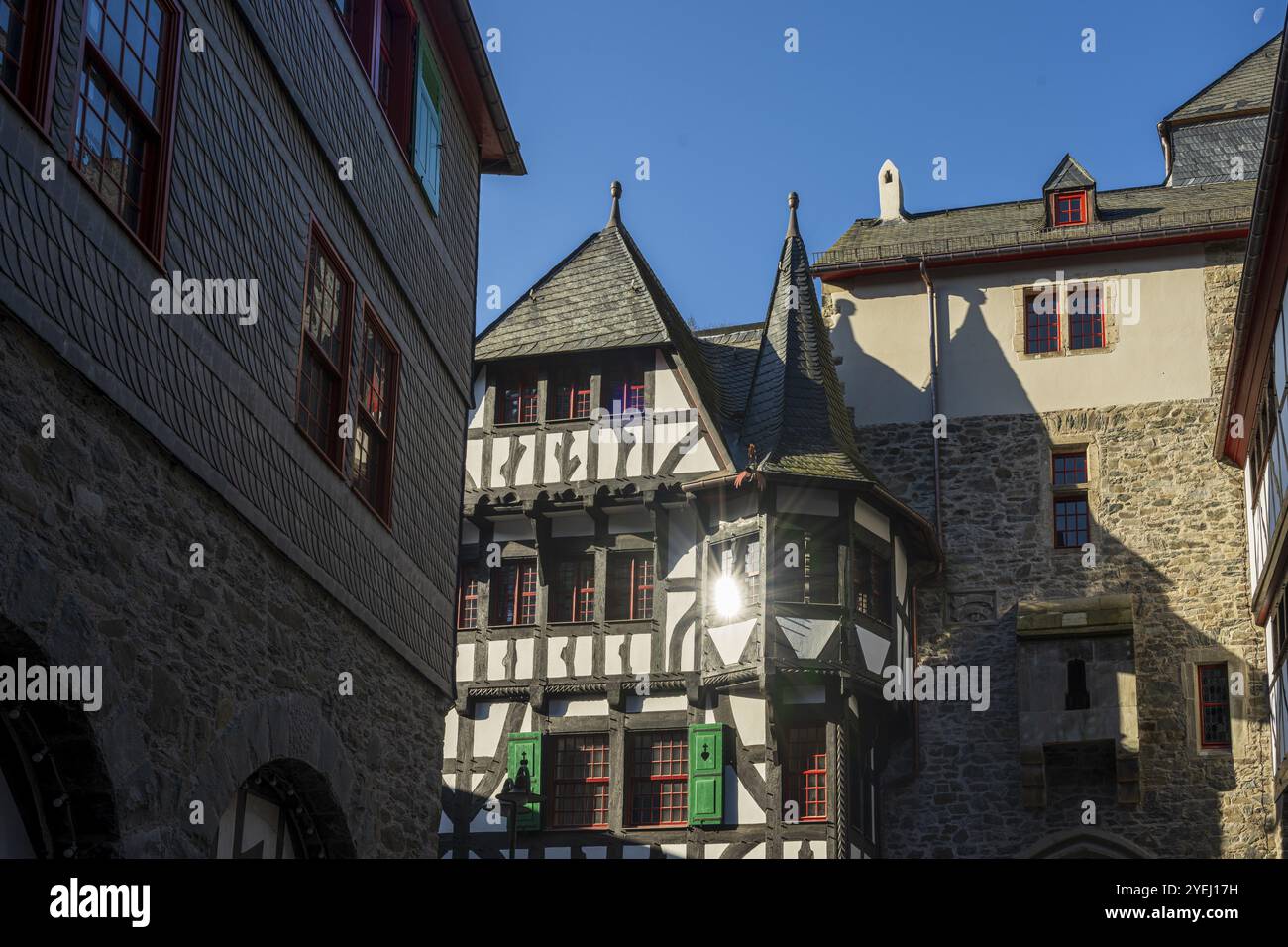 Historic half-timbered house with turquoise-coloured shutters ...