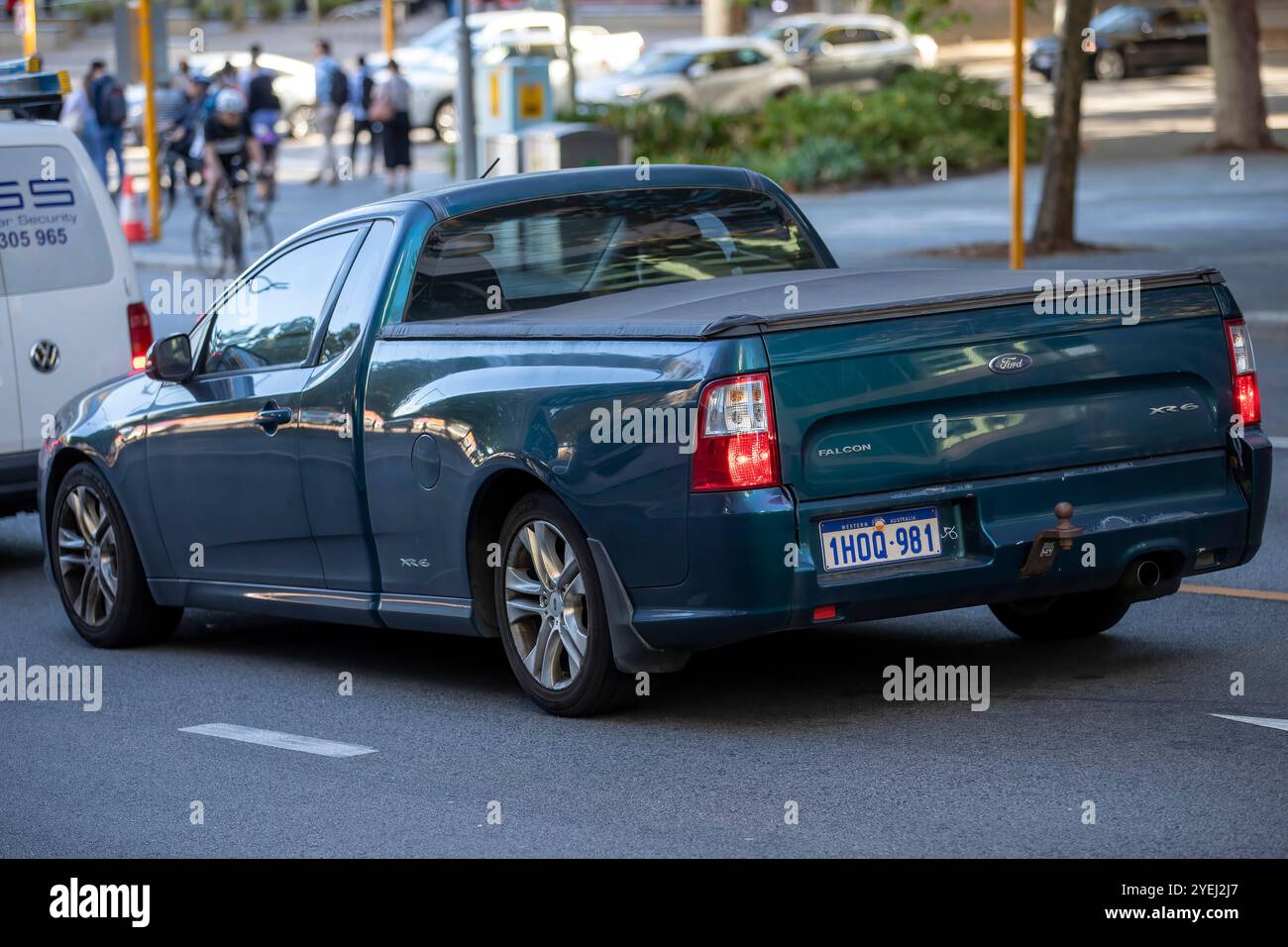 Ford Falcon XR6 utility vehicle driving on a city street, highlighting ...