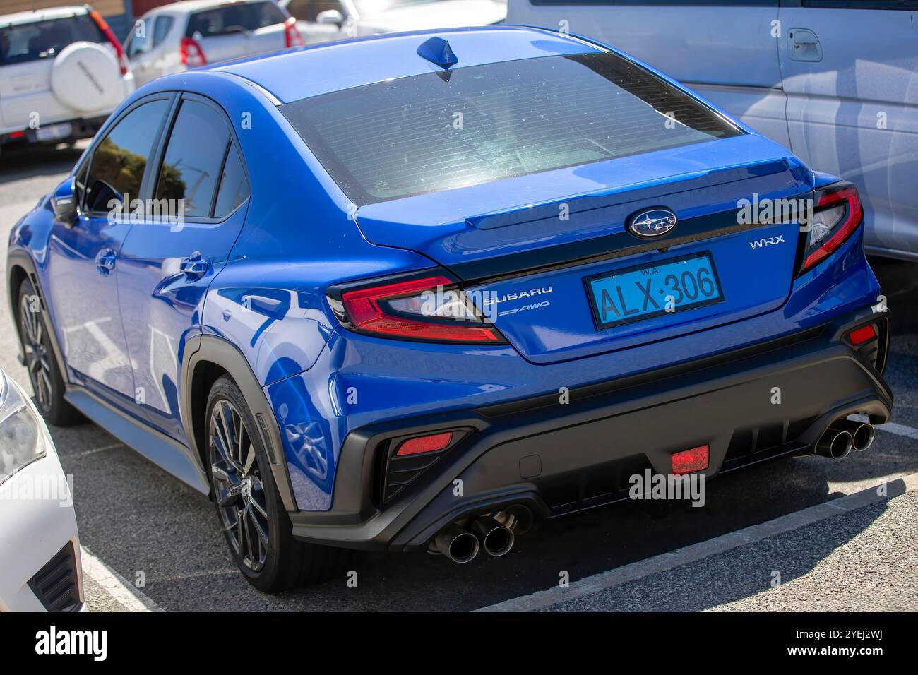 The image shows the rear view of a blue Subaru WRX S4 STI Sport Stock ...