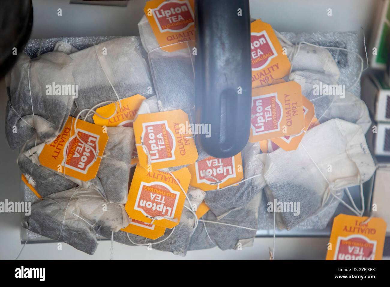 The photo showcases a collection of Lipton tea bags, with their ...