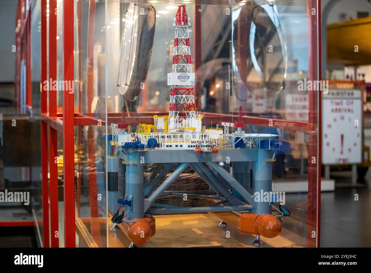 A detailed scale model of an offshore oil rig displayed in a museum ...