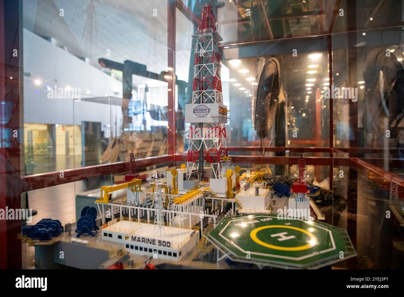 A detailed scale model of an offshore oil rig displayed in a museum ...