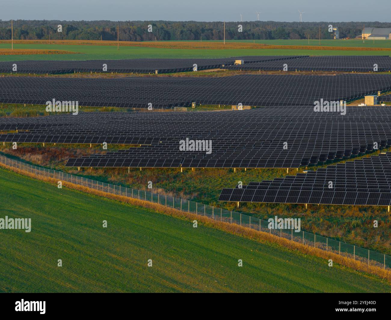 Aerial View of Solar Panel Field with Wind Turbines in Lithuania Stock ...