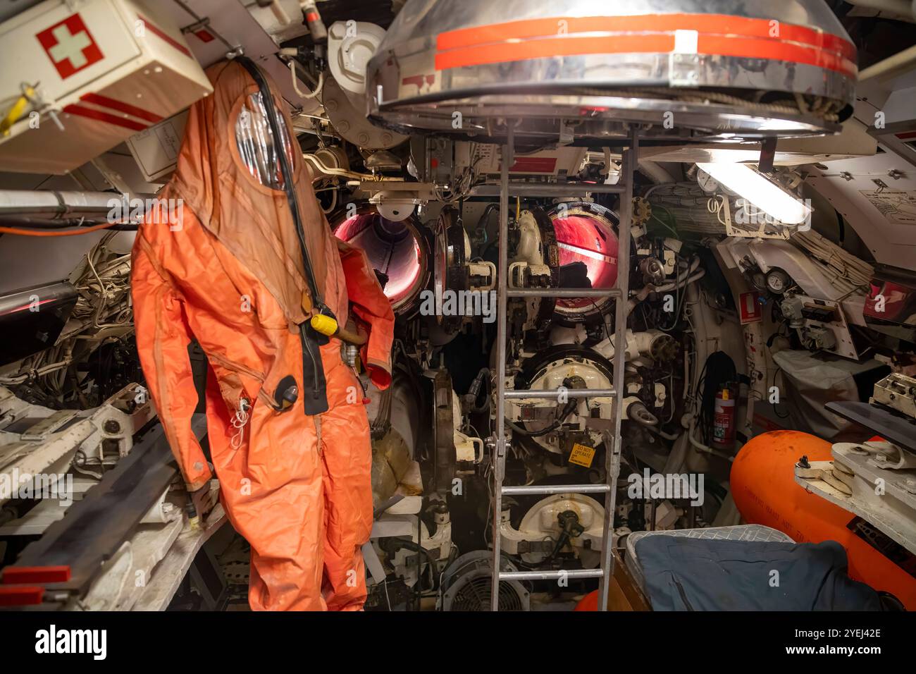 This photograph shows a safety or survival suit displayed inside a ...