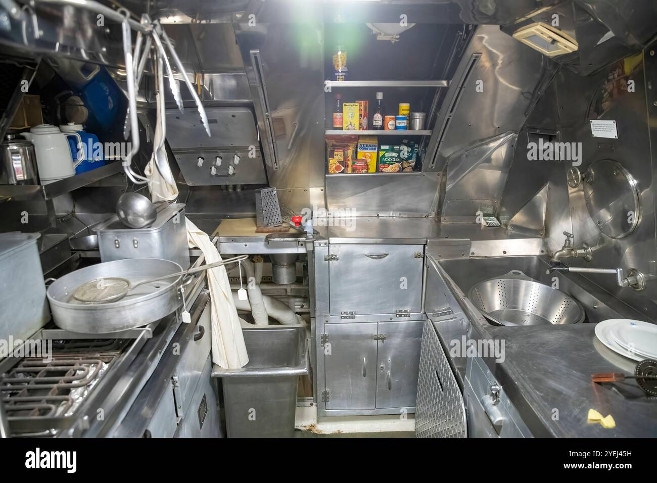 Interior view of a submarine or ship's galley, featuring stainless ...