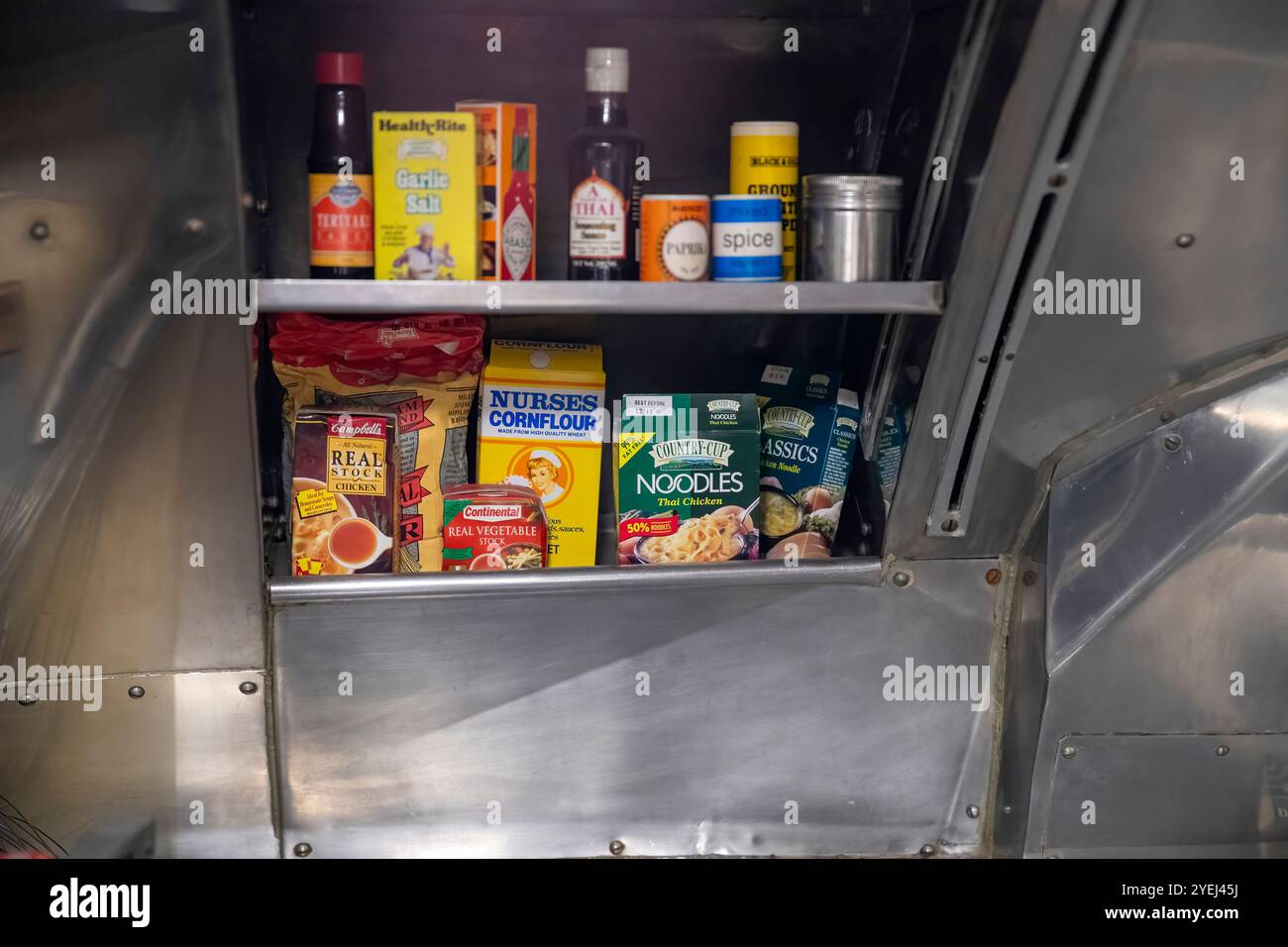 This photograph shows a close-up view of a shelf inside a submarine or ...