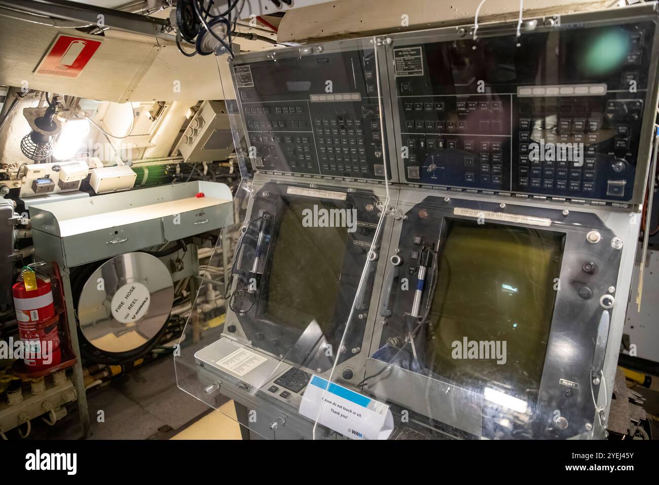 Interior view of a submarine's control station, showing multiple large ...