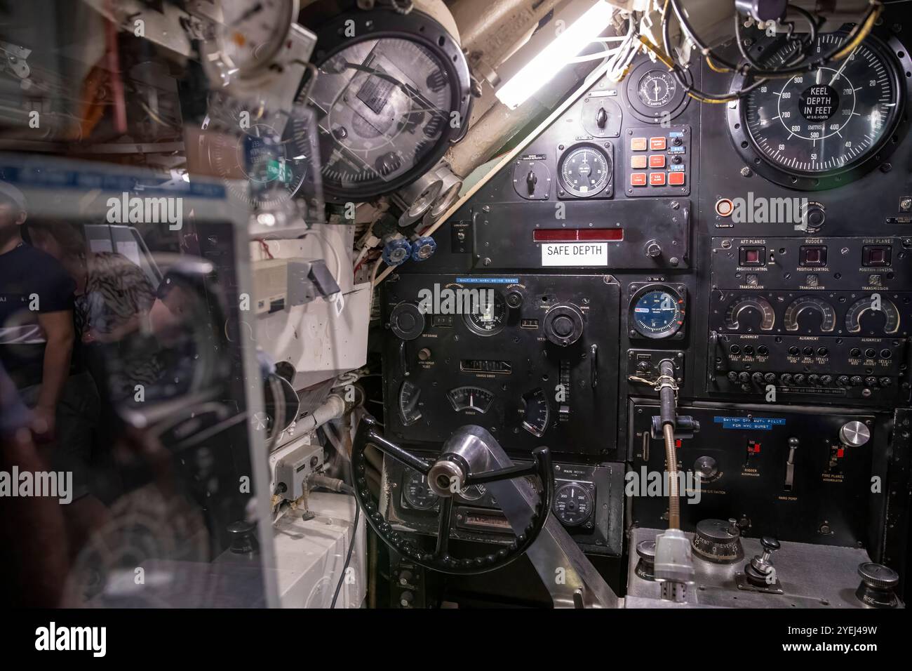 Interior view of a submarine's control panel with multiple gauges ...