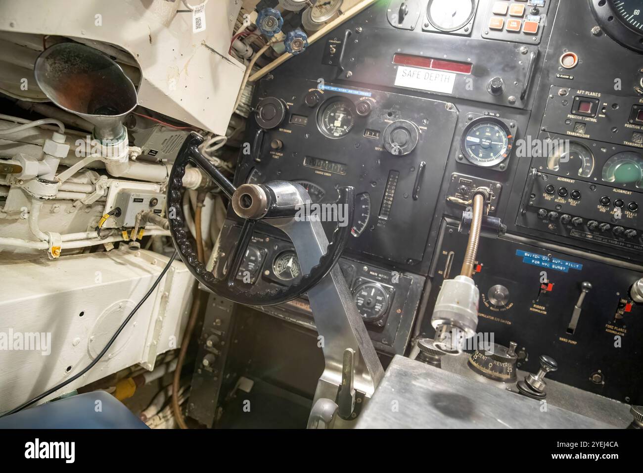 Interior view of a submarine's control panel, featuring a steering ...