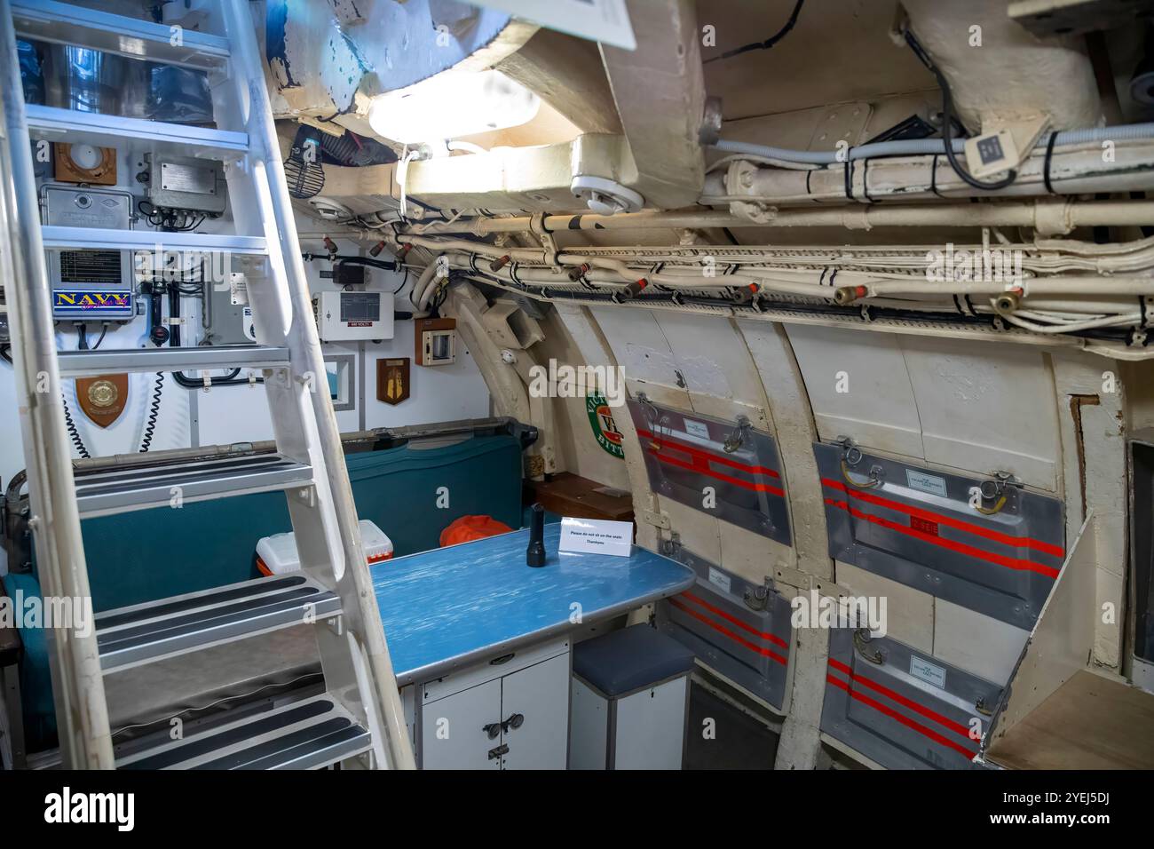 This photograph depicts the interior of a submarine cabin area ...