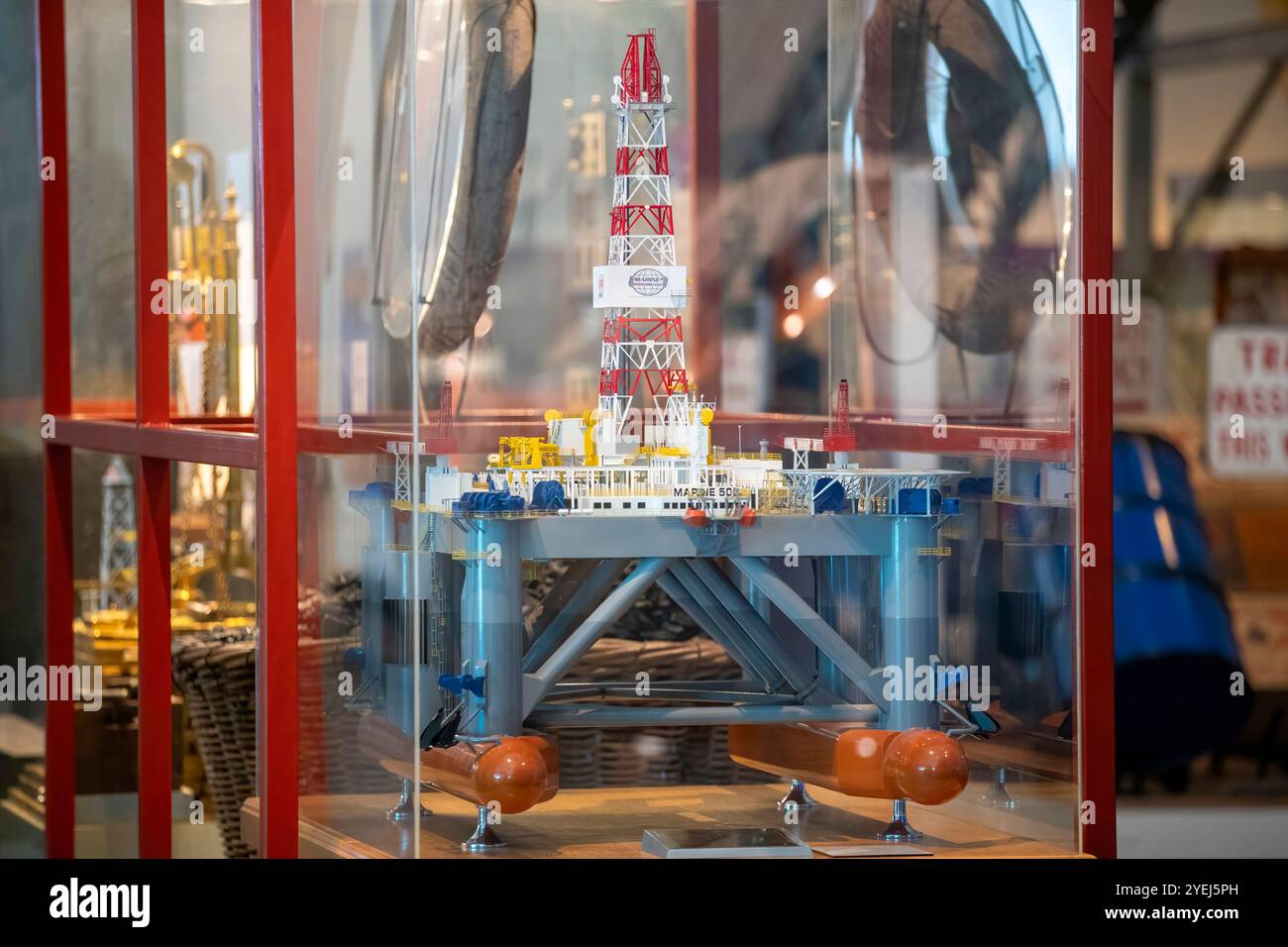 A detailed scale model of an offshore oil rig displayed in a museum ...
