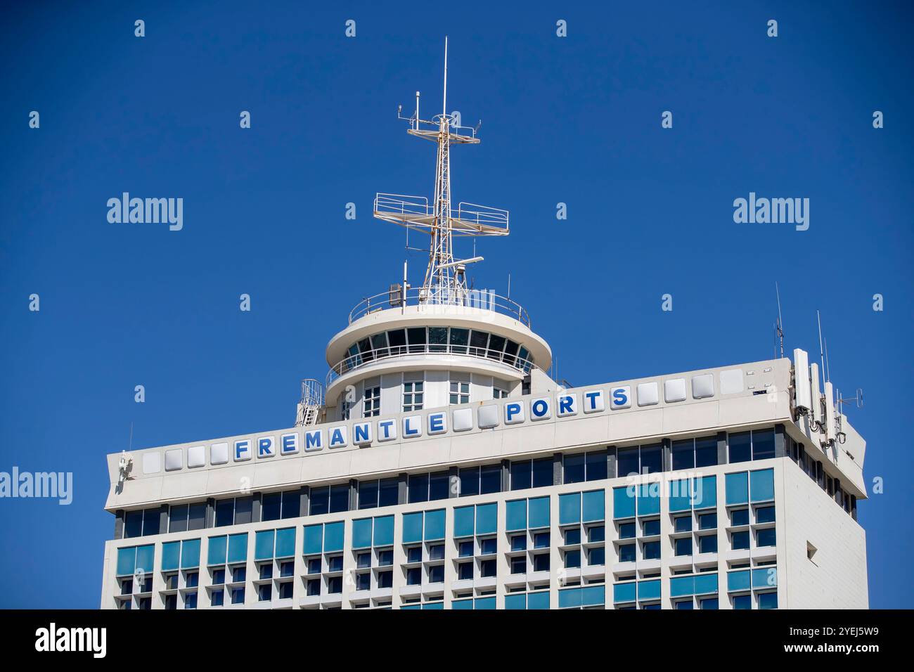 The Fremantle Ports building under a bright blue sky. The building is a ...