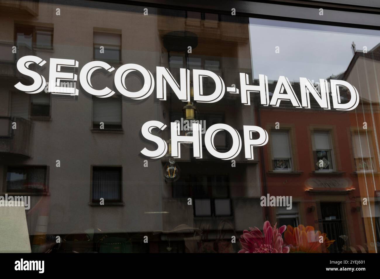 Second hand shop sign on window of local business Stock Photo - Alamy