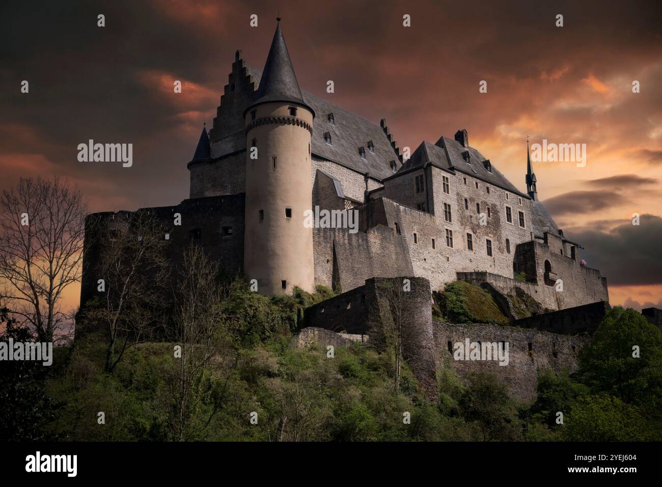 Medieval Vianden castle in Luxembourg under a moody sky Stock Photo - Alamy