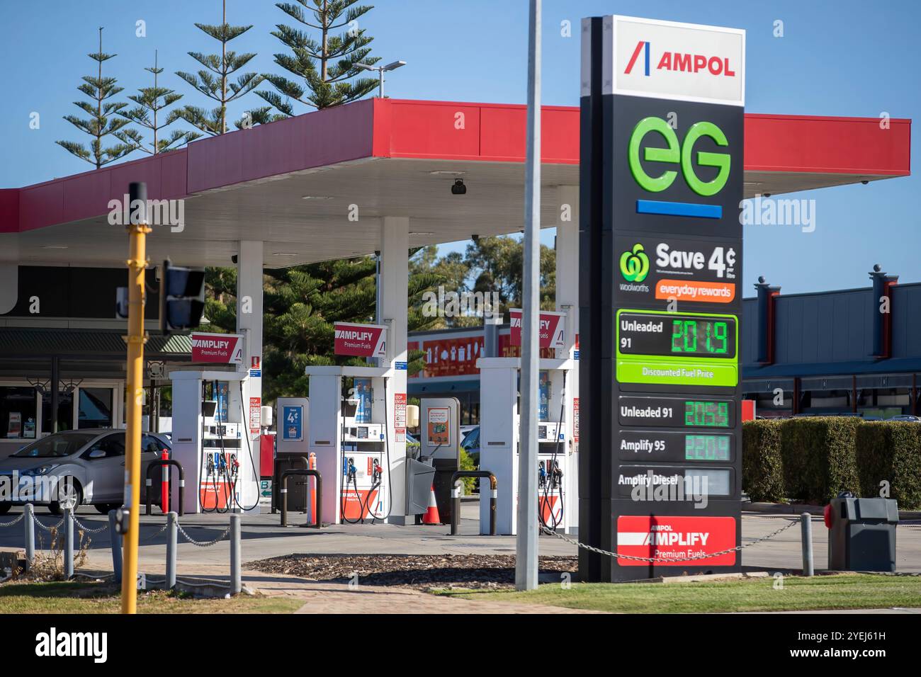 A modern Ampol petrol station with multiple fuel pumps and a digital fuel price display Stock ...