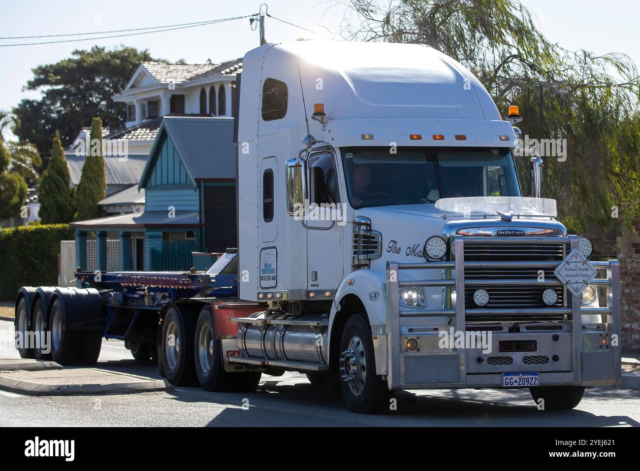 A front view of a white Freightliner coronado semi-truck with a bull ...
