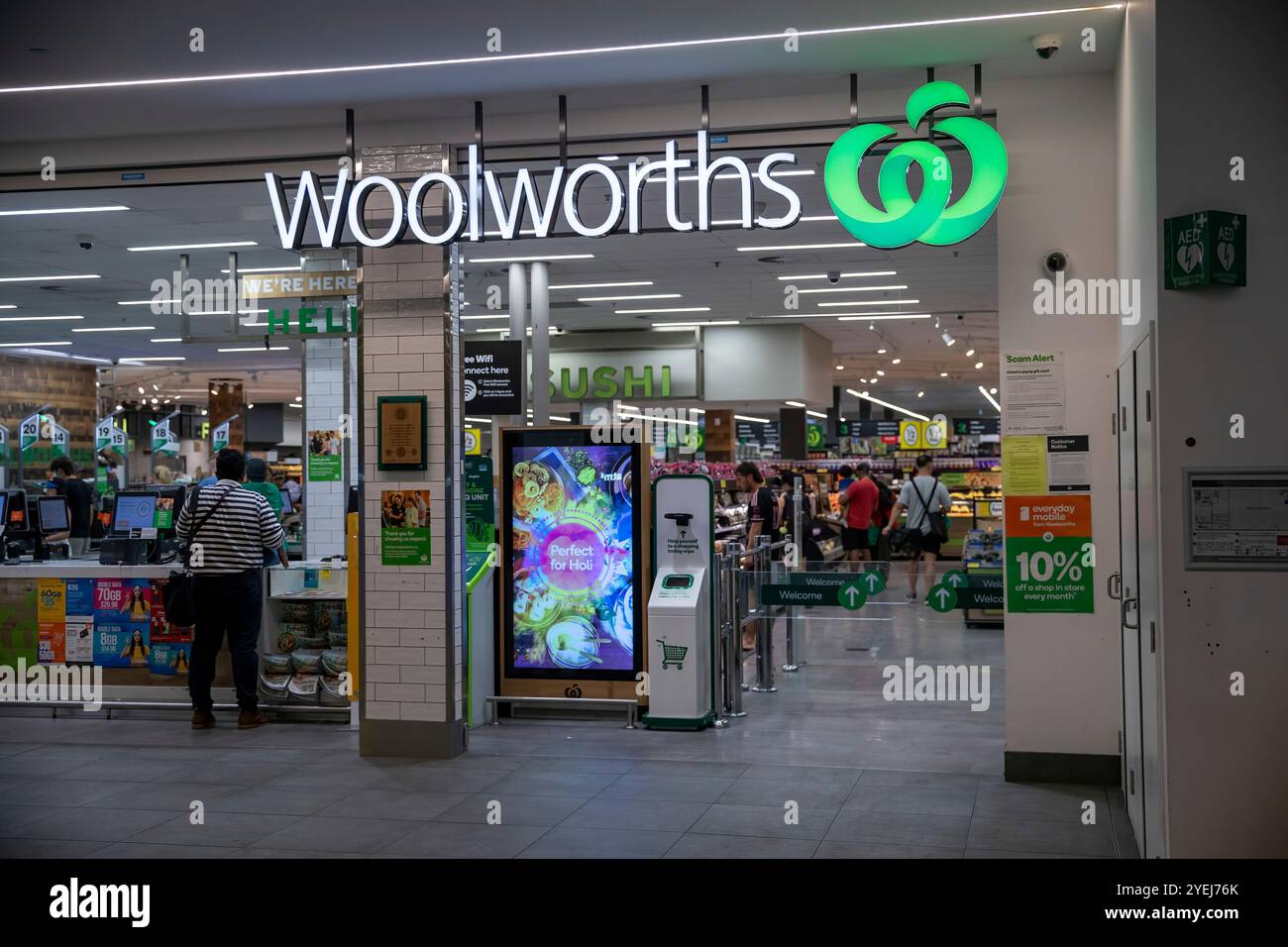 Exterior view of a Woolworths store entrance inside a shopping mall ...