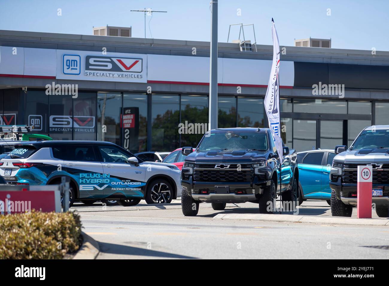 A display of cars at the GM Specialty Vehicles dealership, including a ...