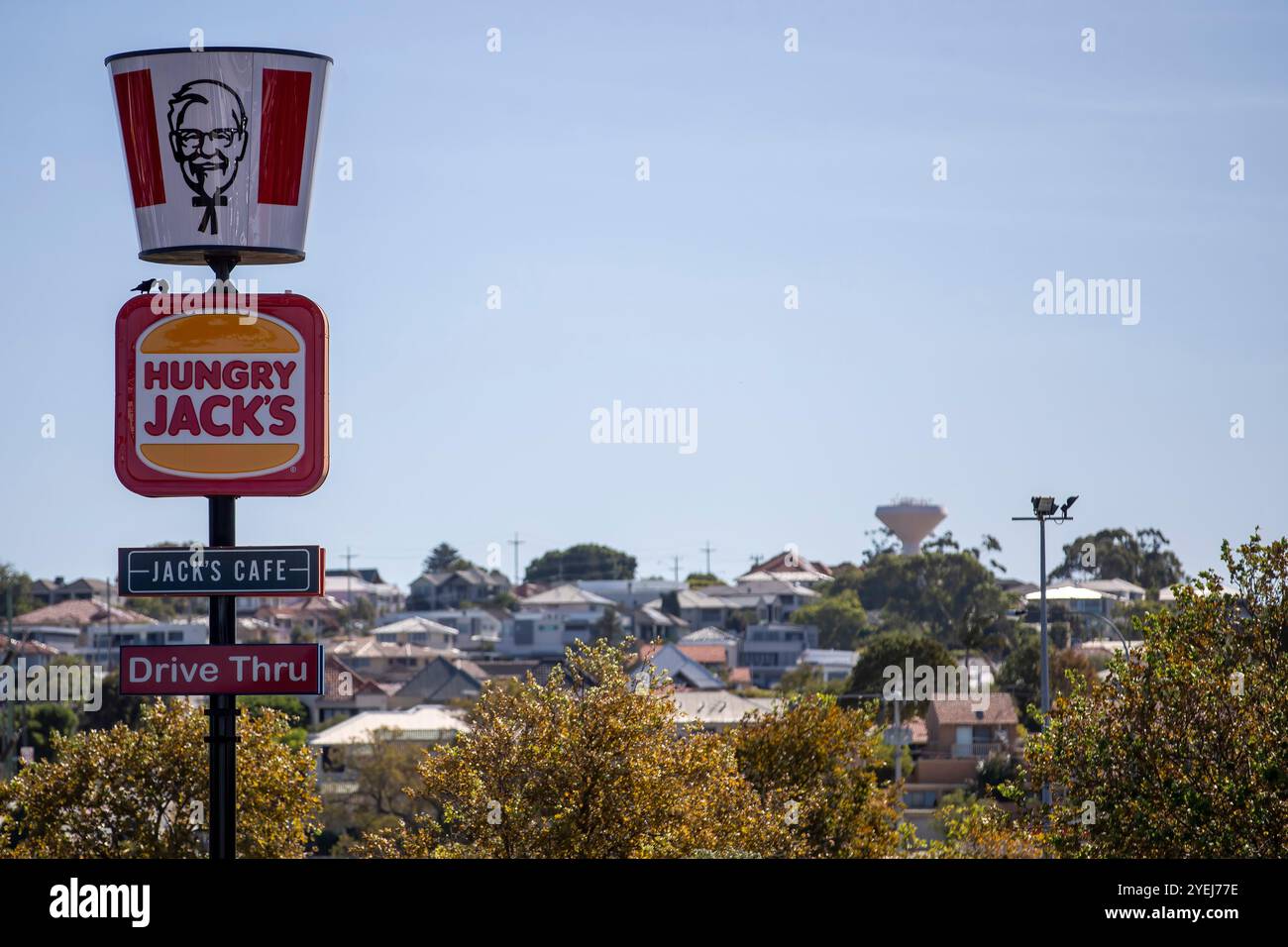 A roadside sign featuring KFC and Hungry Jack's branding, along with "Jack's Cafe" and "Drive ...
