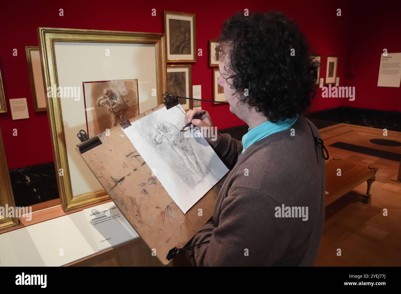 An artist in residence sketching Lelio Orsi's A crossbowman during the ...