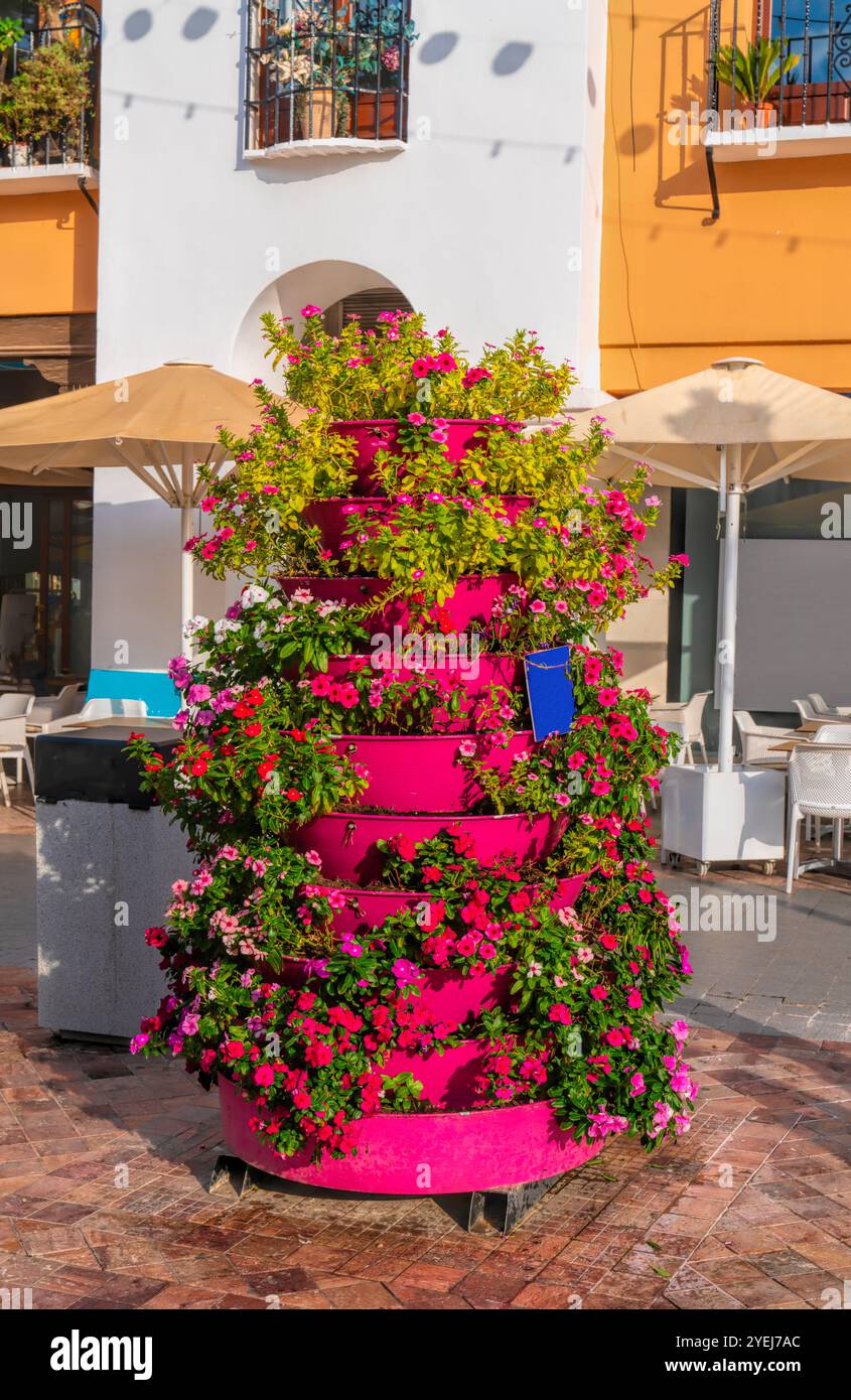 Colourful pink flower display Spanish town square of Nerja, Andalusia ...