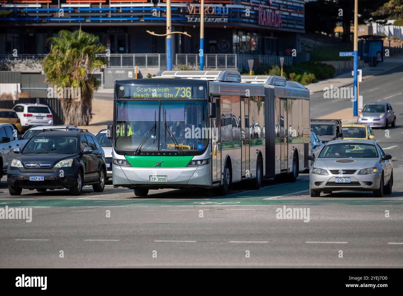 The photo depicts a bus labeled "736 Scarborough Beach Bus Stn" in the ...