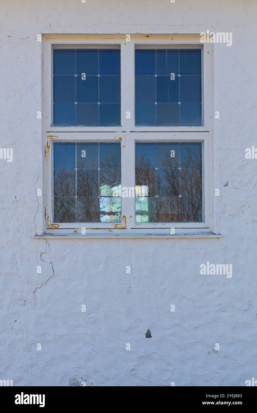 Glass window with white frame on stone wall Stock Photo - Alamy