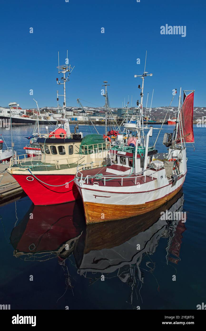 Fishing trawlers in the harbor in clear summer weather Stock Photo - Alamy
