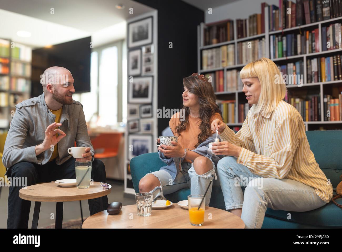 Group of creative and smart young students discussing work, sharing ...