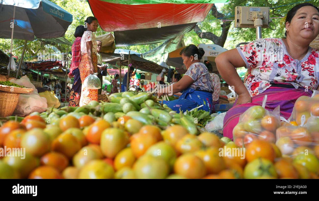 Vibrant Scenes: Close-Up of Women Sellers at a Fruit Market in Myanmar ...