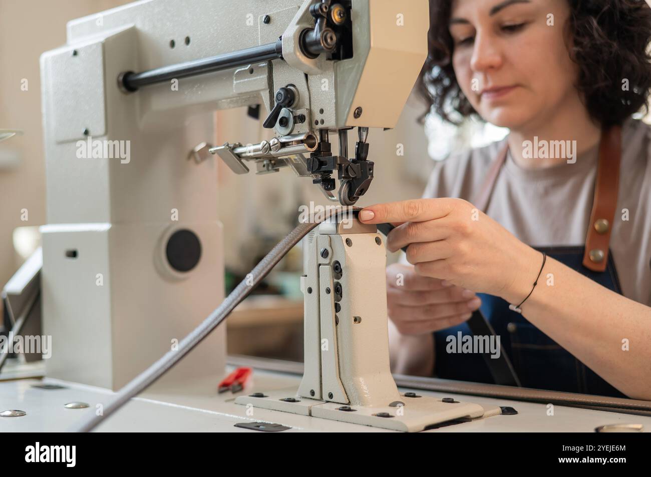 Woman tanner sews leather hi-res stock photography and images - Alamy