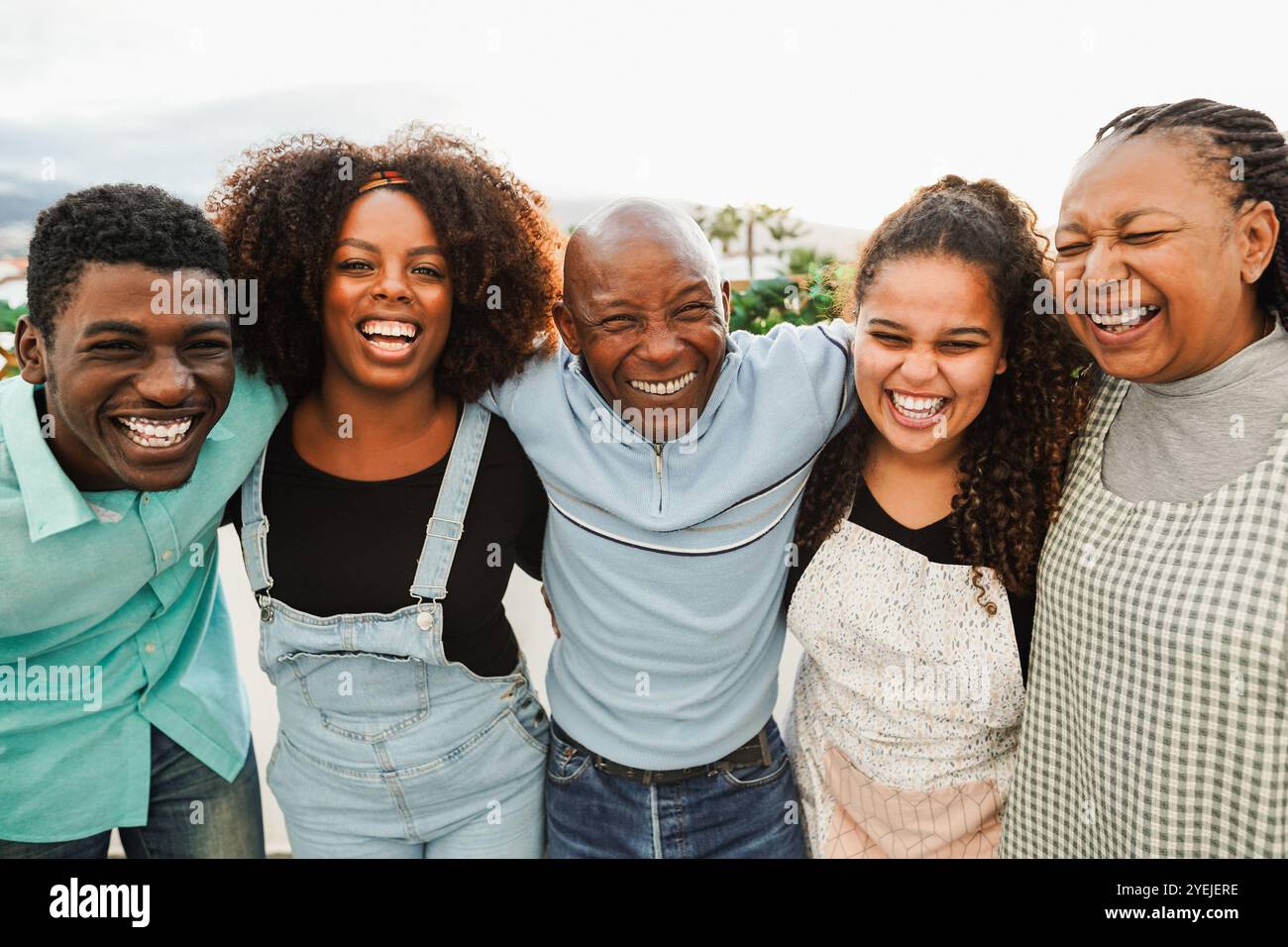 Happy african family having fun together at home terrace during a ...