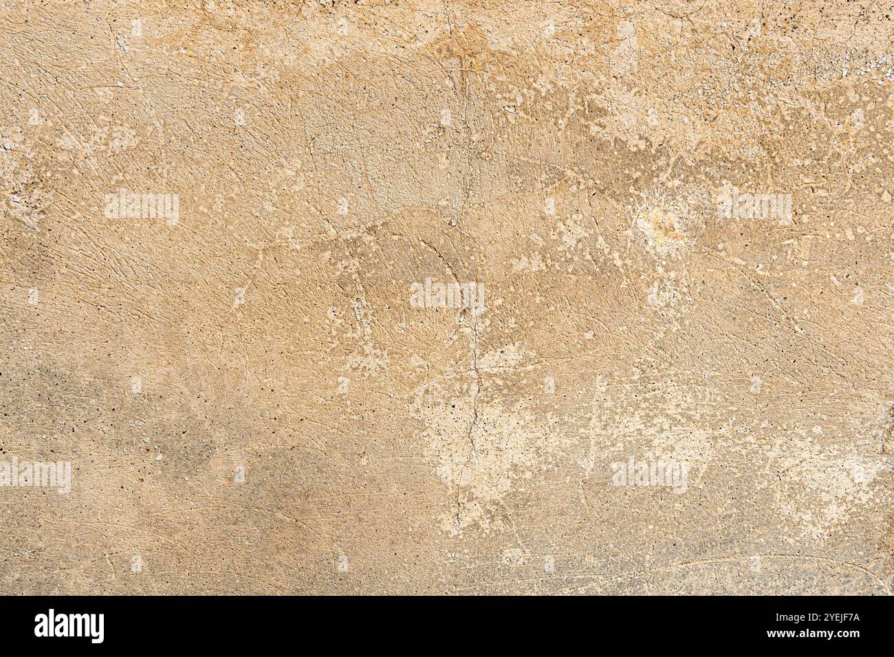 Concrete or plaster surface with a rough texture. Visible cracks ...