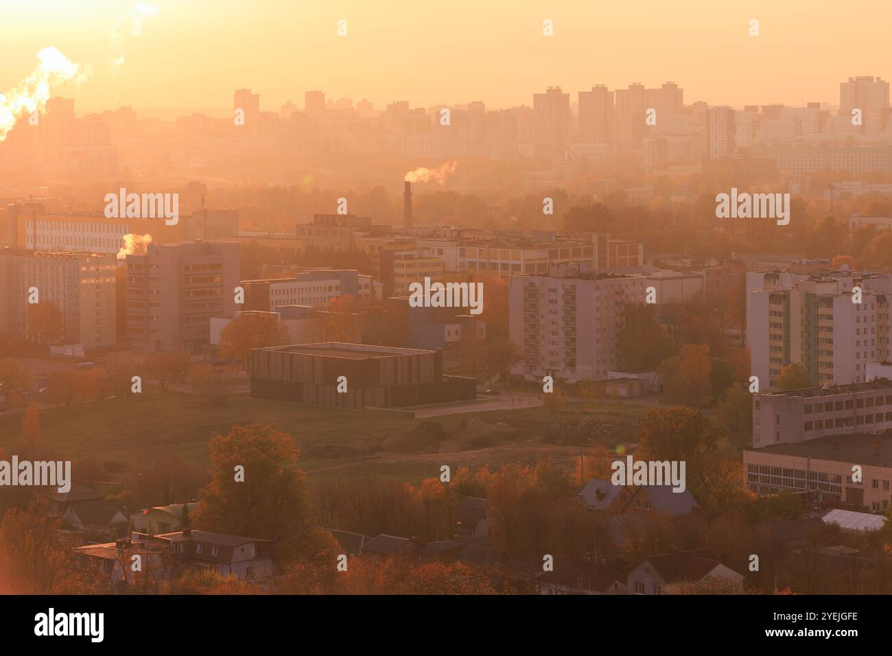 Evening view of the city. Sunset orange sky and beautiful cityscape ...