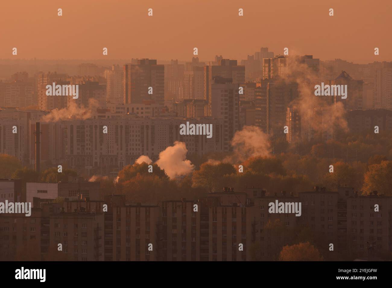 Evening view of the city. Sunset orange sky and beautiful cityscape ...