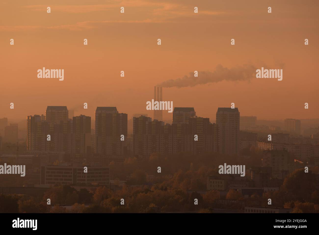 Evening view of the city. Sunset orange sky and beautiful cityscape ...